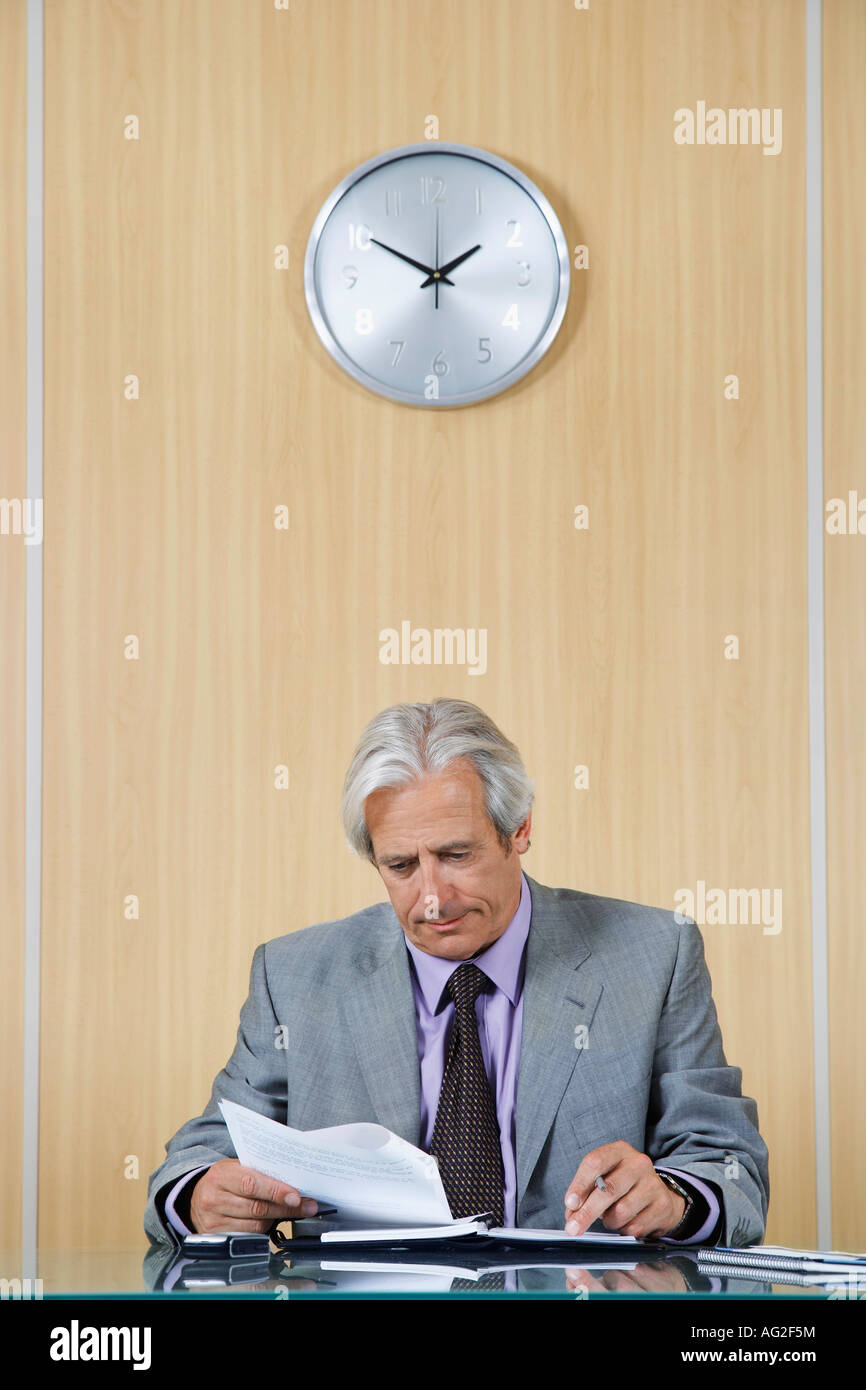 Business man reading papers in office Stock Photo - Alamy Business man reading papers in office Stock Photo - Alamy
