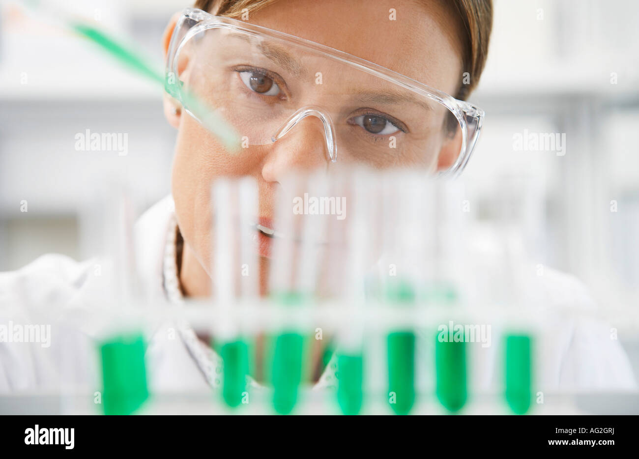Scientist filling test tubes with pipette in laboratory, close-up Stock ...