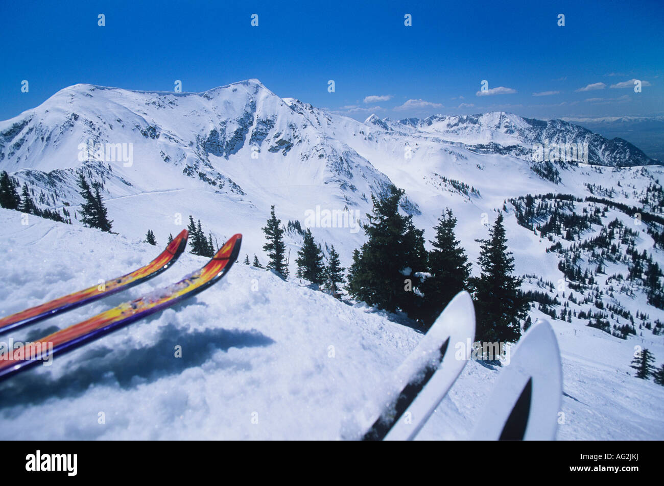 Two pairs of skis on edge of ski run Stock Photo - Alamy
