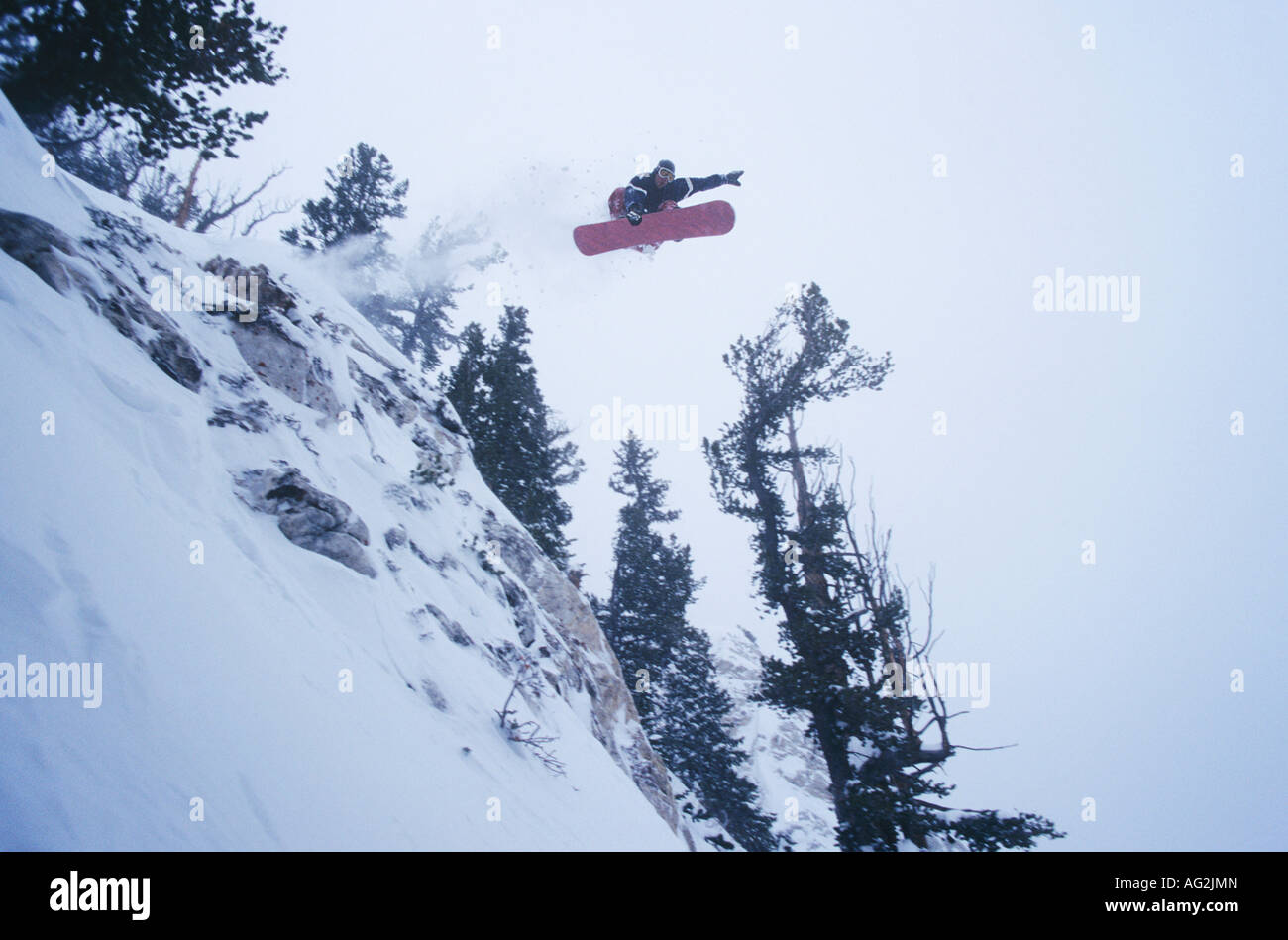 Person on snowboard, jumping, low angle view Stock Photo - Alamy