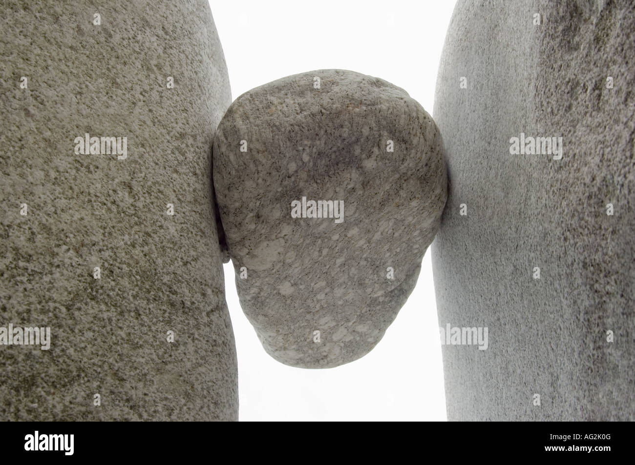 Rock wedged between two boulders Stock Photo - Alamy