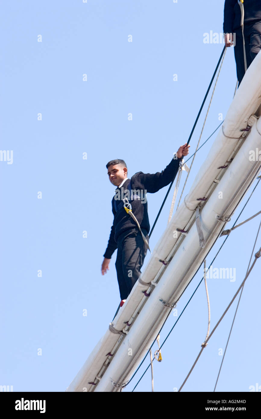 Crew members display on masts and sails of Indian Navy training ship ...