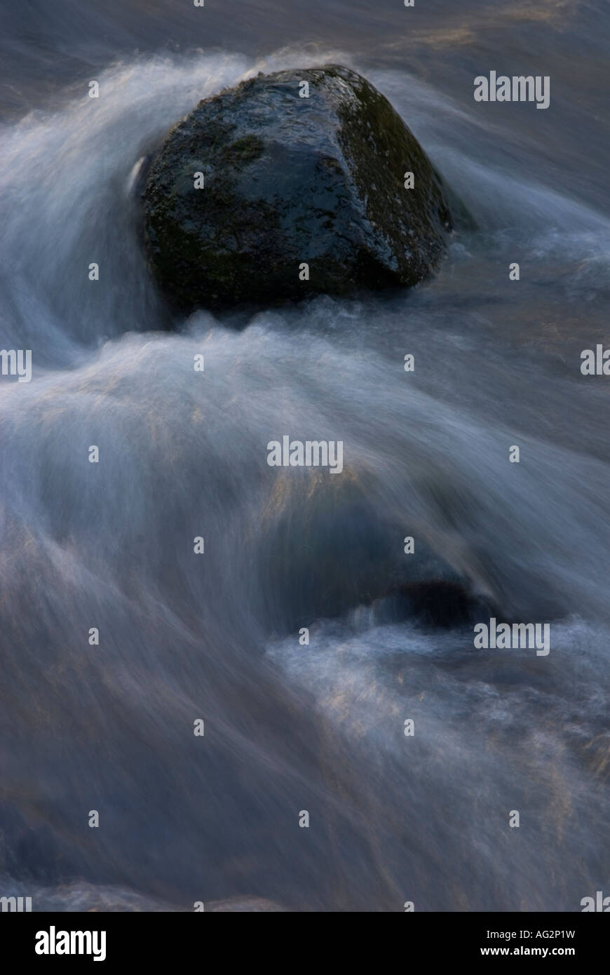 rock and swirling water Stock Photo - Alamy