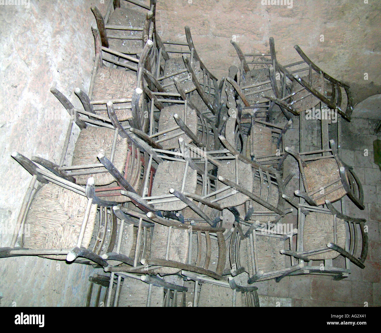 batches of dusty old grey chairs Stock Photo - Alamy
