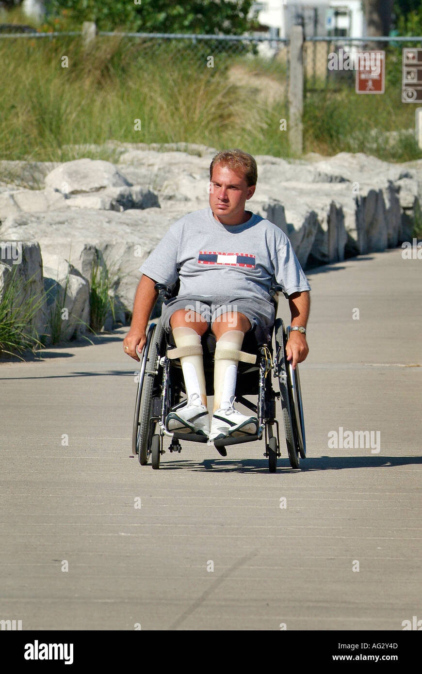 Handicapped male exercises at Grand Haven State Park on Lake Michigan ...