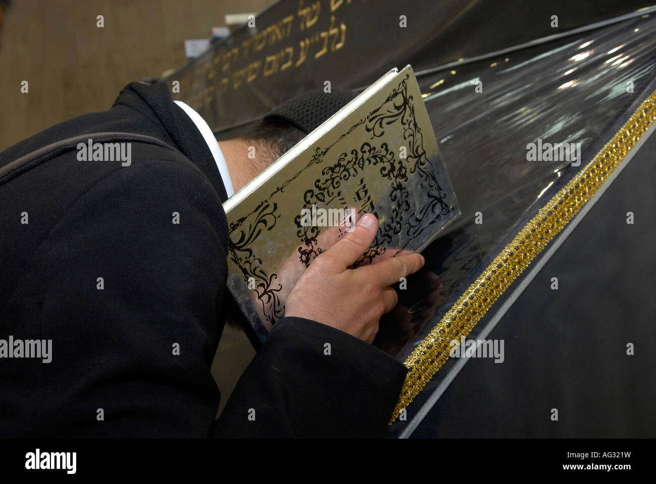 Sephardic Jew praying at the grave of the Moroccan Sephardic rabbi and ...