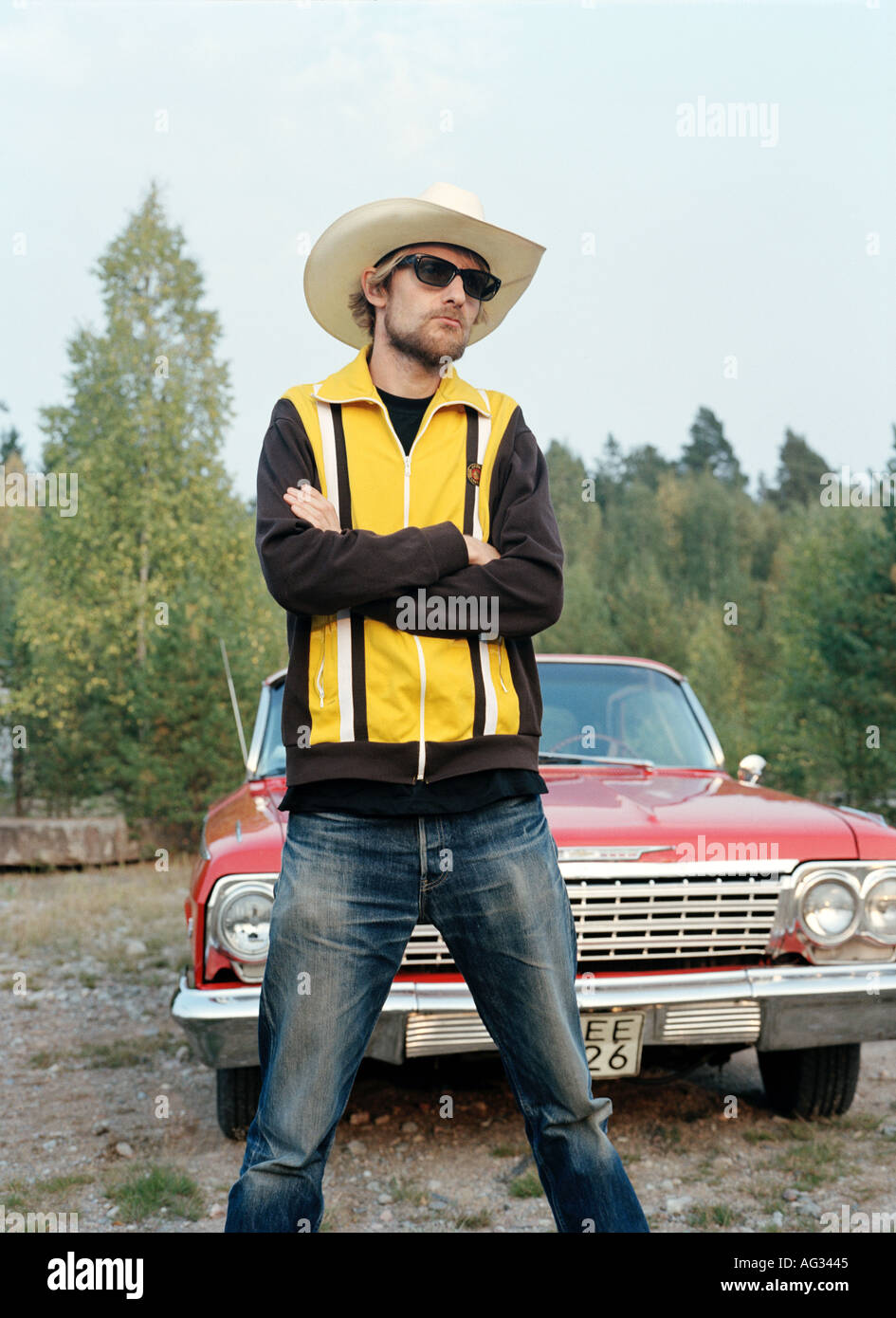 Cool cowboy at his Chevrolet Impala Stock Photo - Alamy
