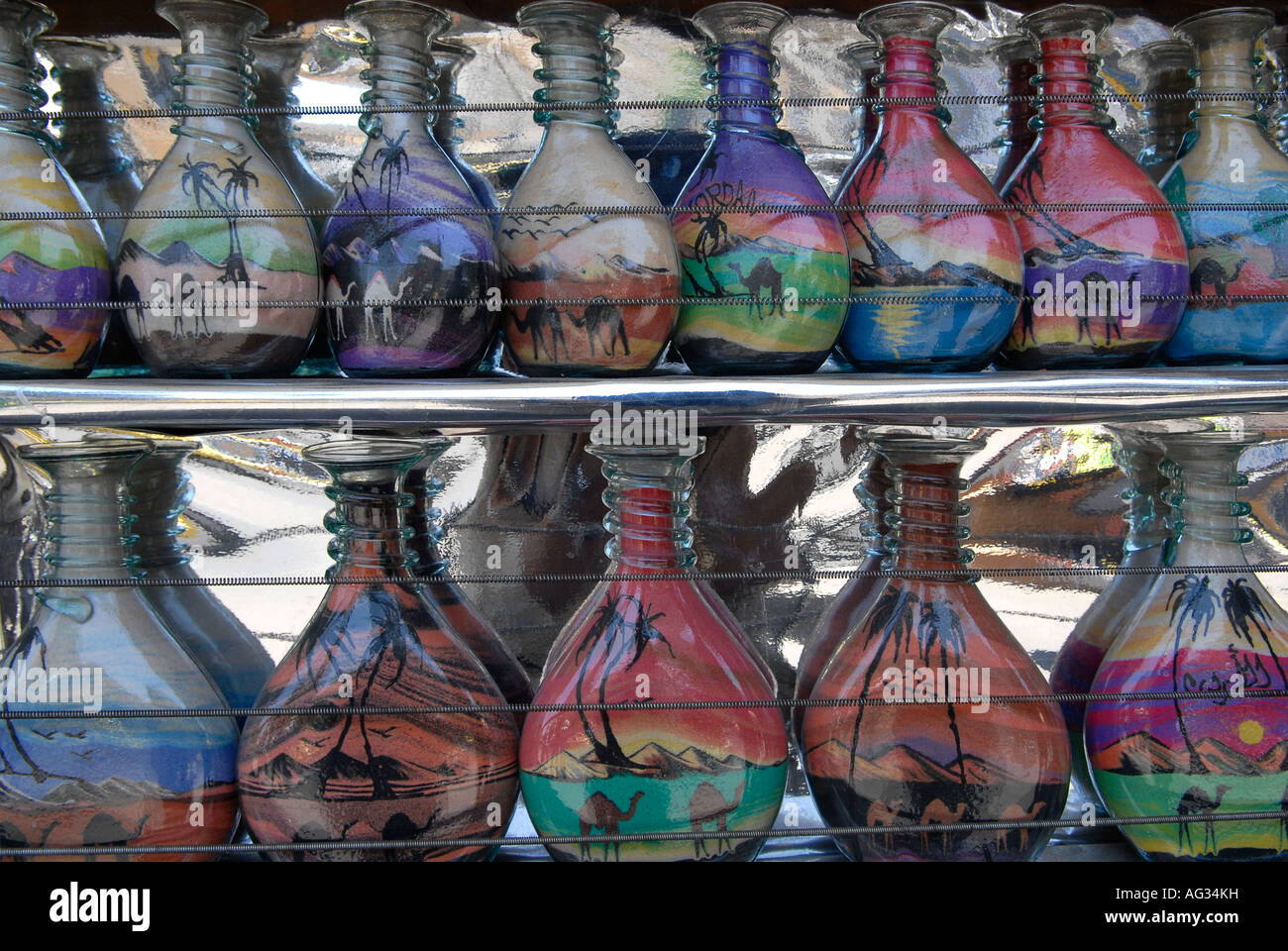 Stack of sand bottles with different kinds of coloured sand taken from ...