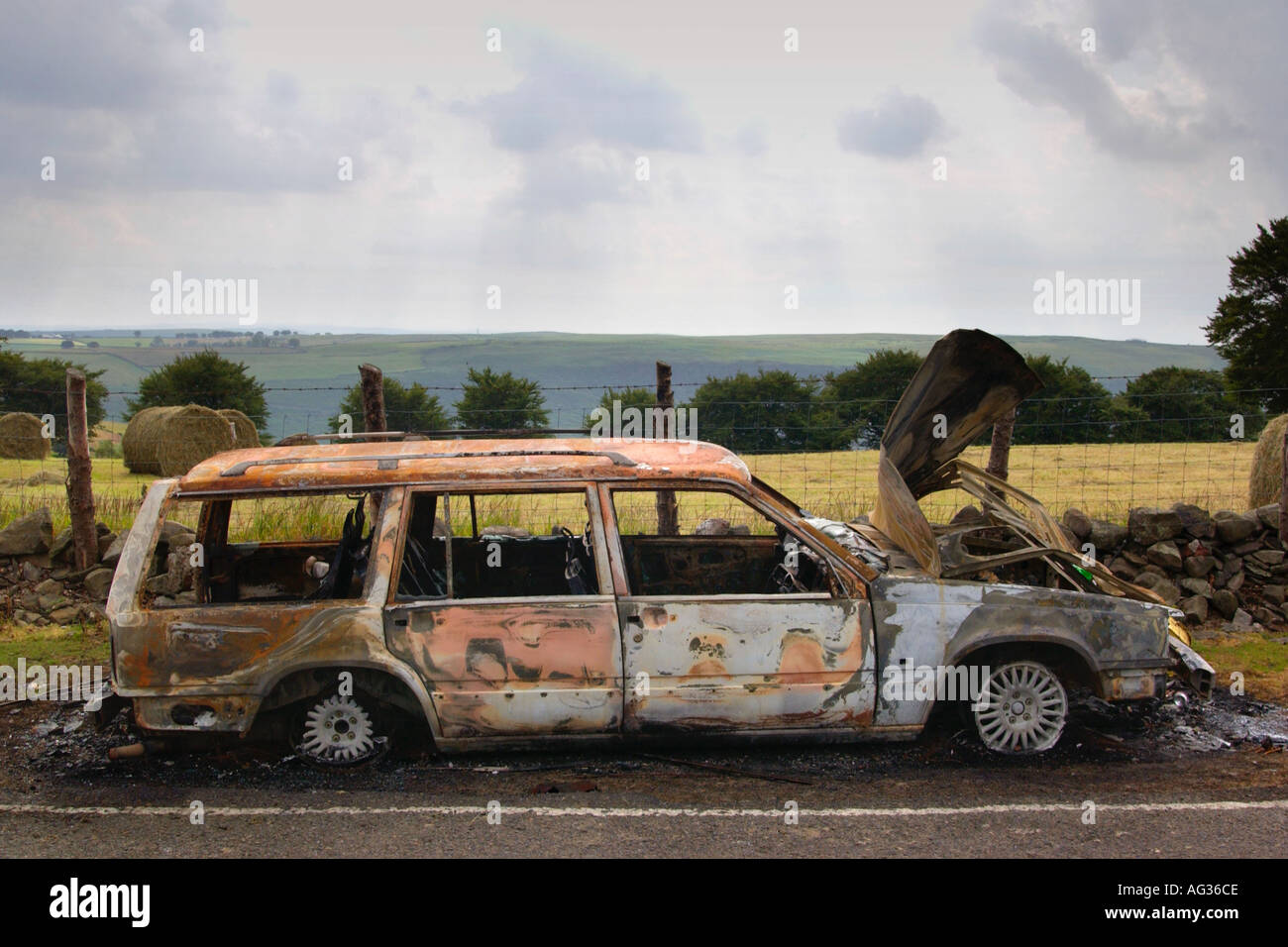 Stolen Volvo Estate burnt out and dumped on side of road in South Wales ...