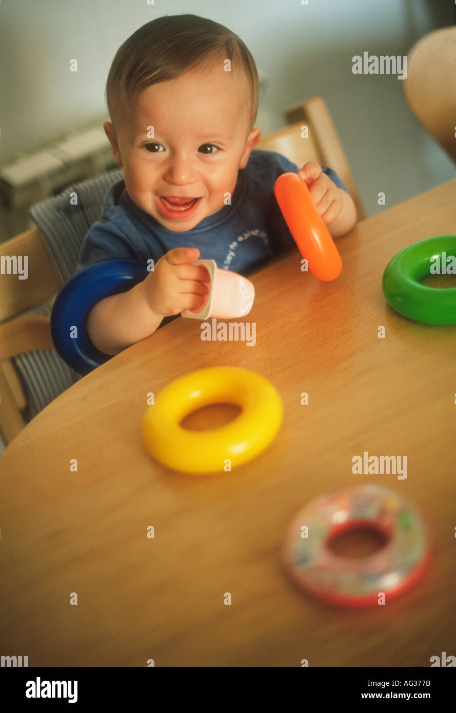 BABY PLAYING AT HOME Stock Photo - Alamy
