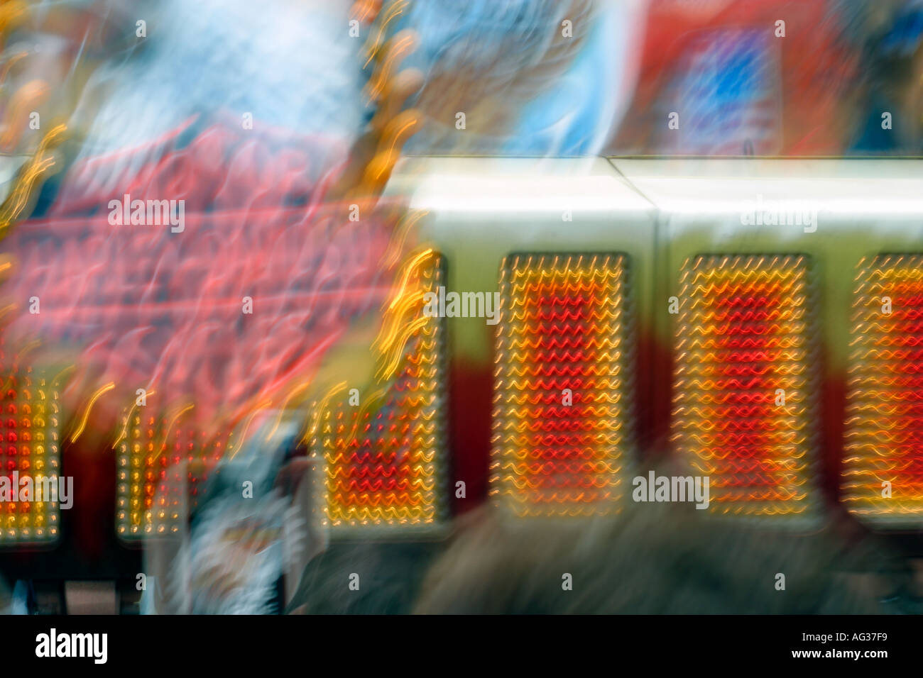 Moving fairground ride showing detail of lights Stock Photo - Alamy