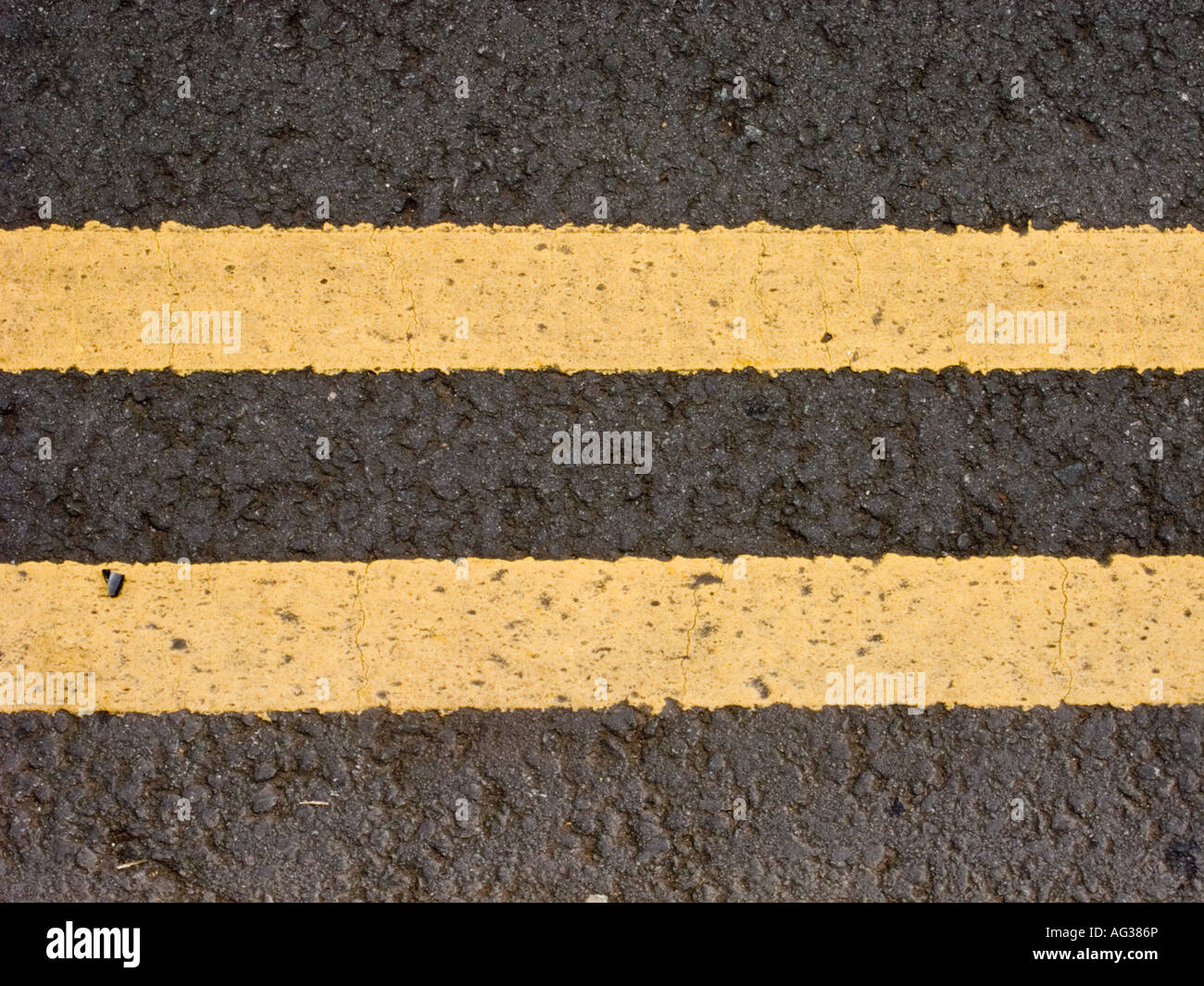Double yellow lines Stock Photo - Alamy
