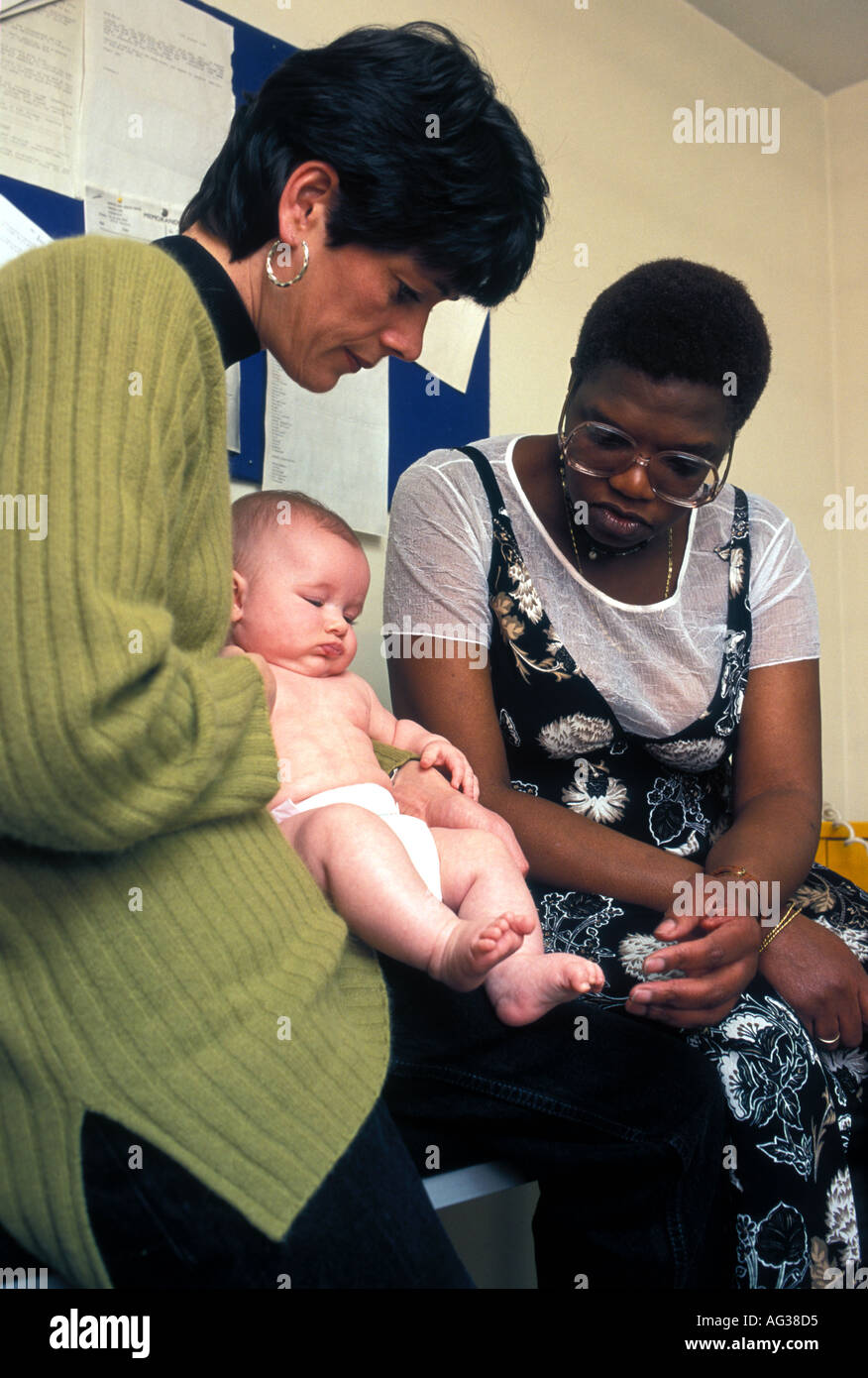 Mother and baby visiting health visitor for post natal check Stock ...