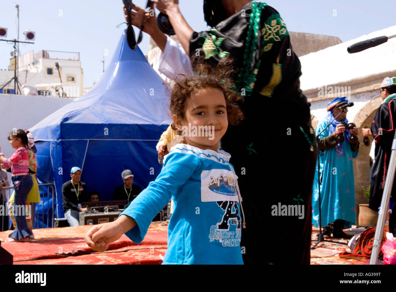 girl dancing at a performance at the Gnawa festival in Essaouira ...