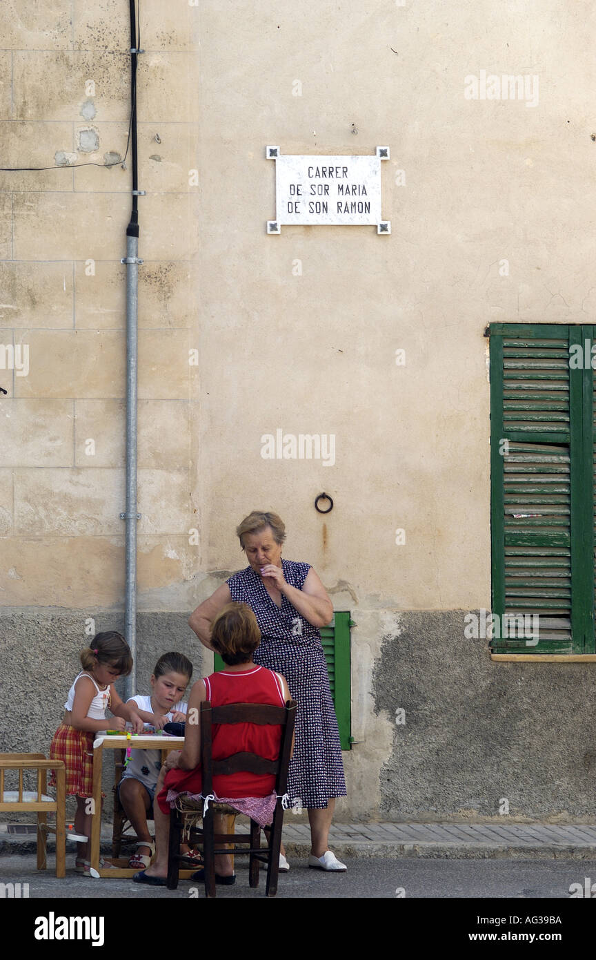 Group of people talking on the street in Costitx Mallorca Majorca Spain ...