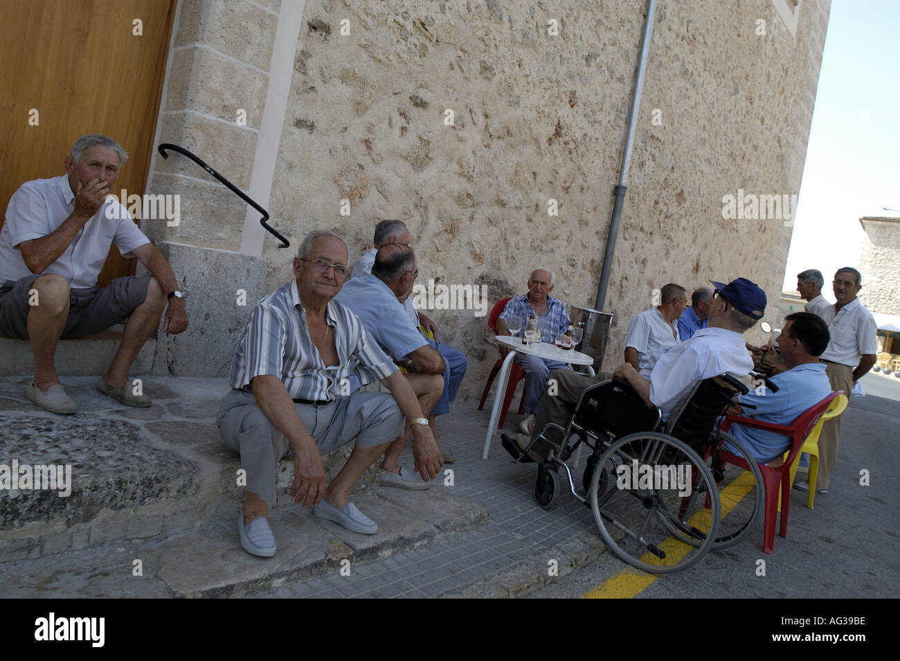 Group of people talking on the street in Costitx Mallorca Majorca Spain ...