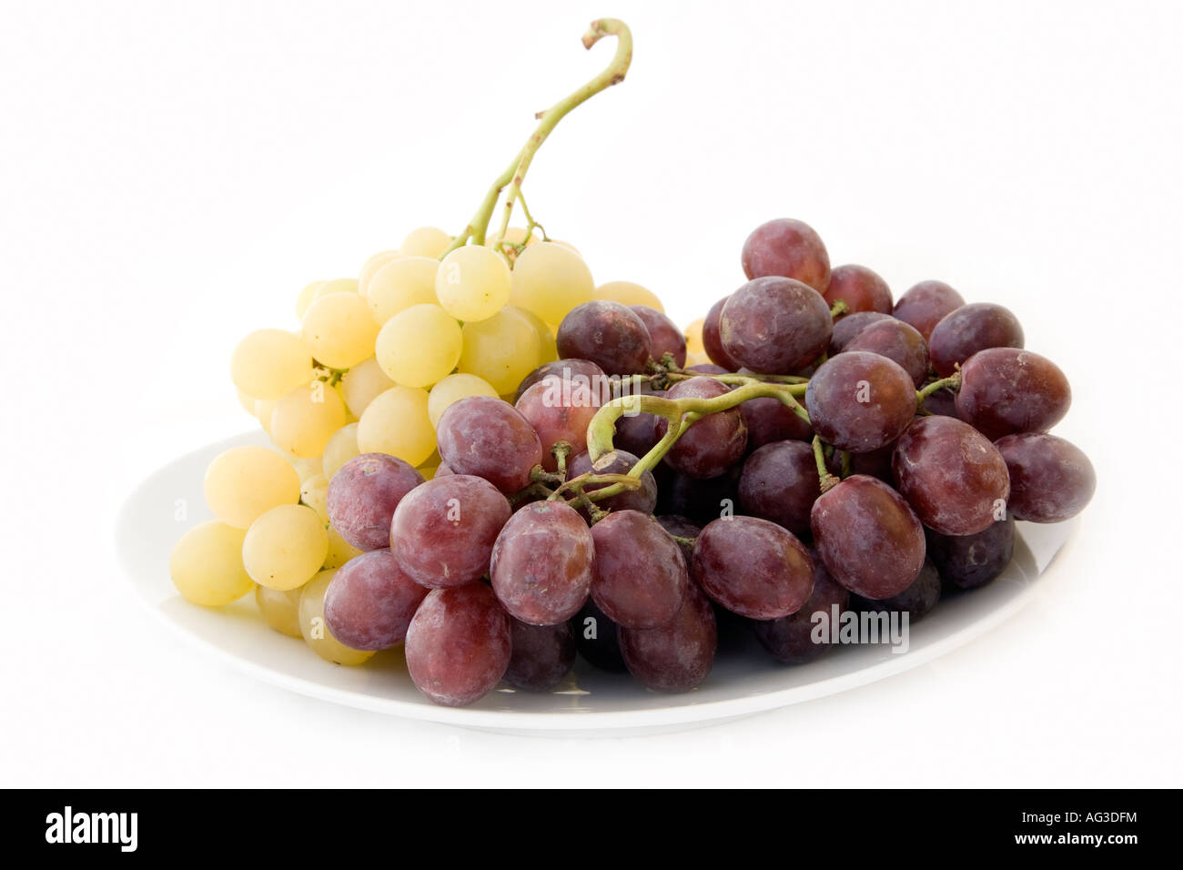 Bunch of grapes on a plate Stock Photo - Alamy