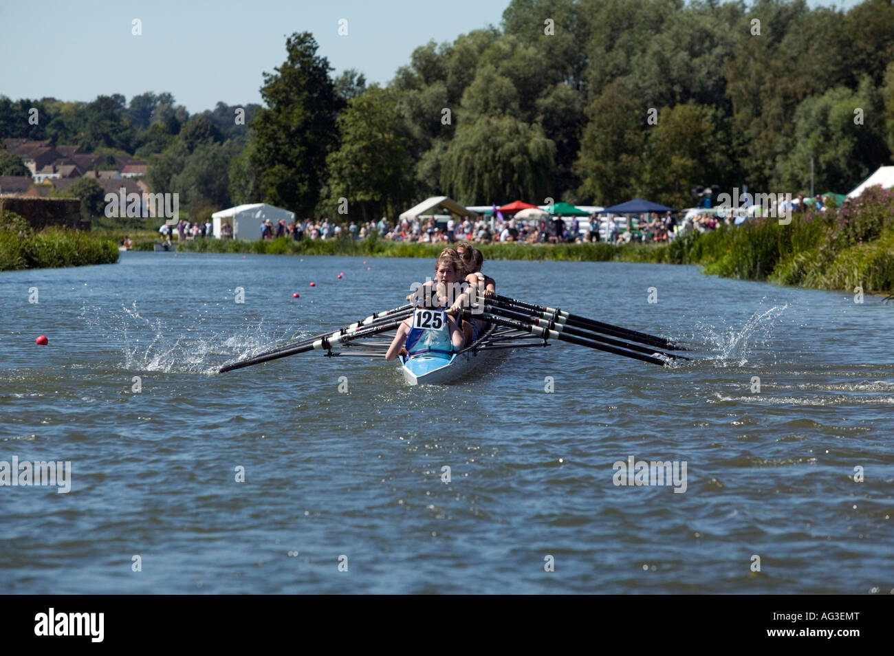 Female rowers in coxed eight racing in rowing regatta River Stour ...