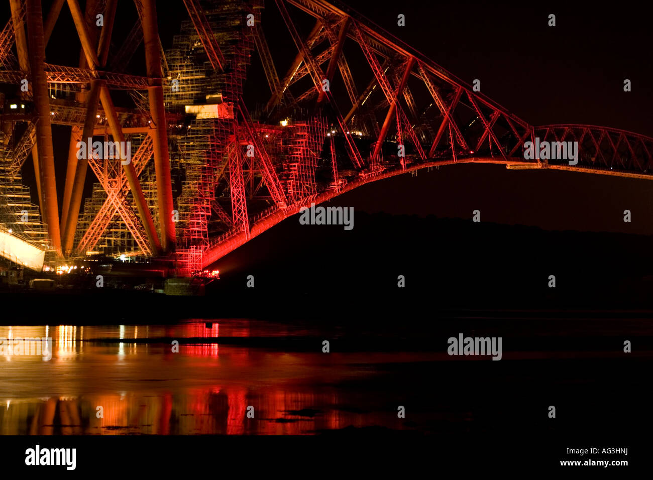 Forth Rail bridge at night lit up with red floodlighting Stock Photo ...