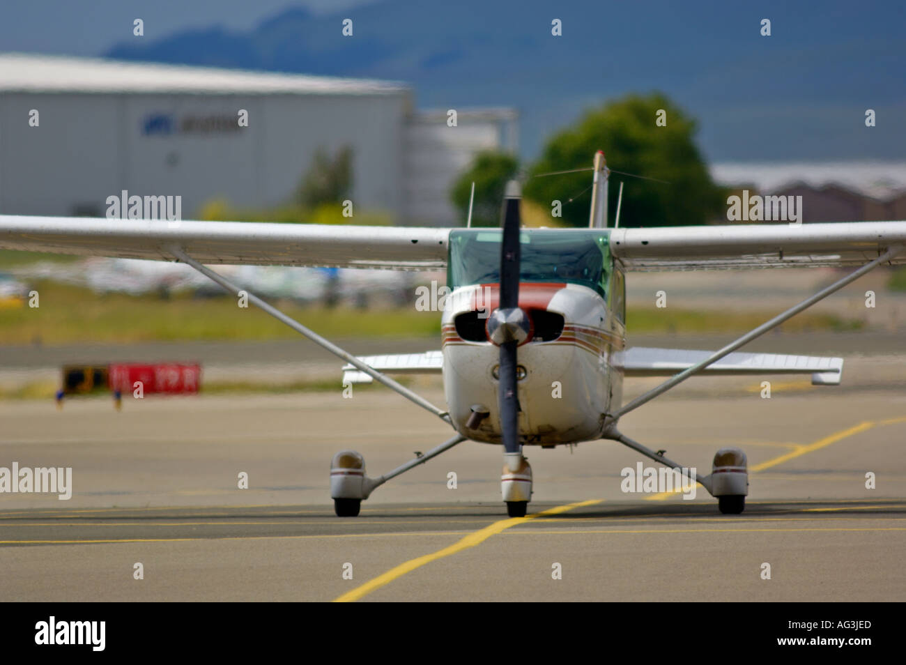 Small Cessna single engine airplane taxiing on taxiway at Buchanan ...