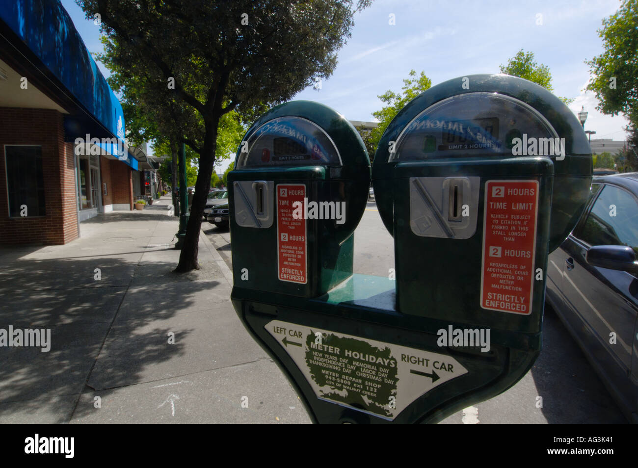 Car parking time pay meter in suburban commercial retail shoping ...