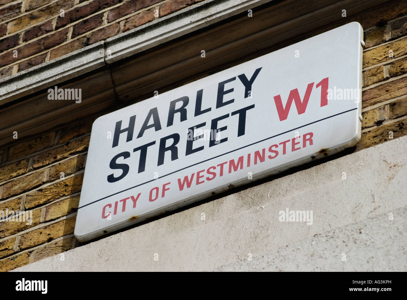 Harley Street W1 London City of Westminster street sign on wall Stock ...