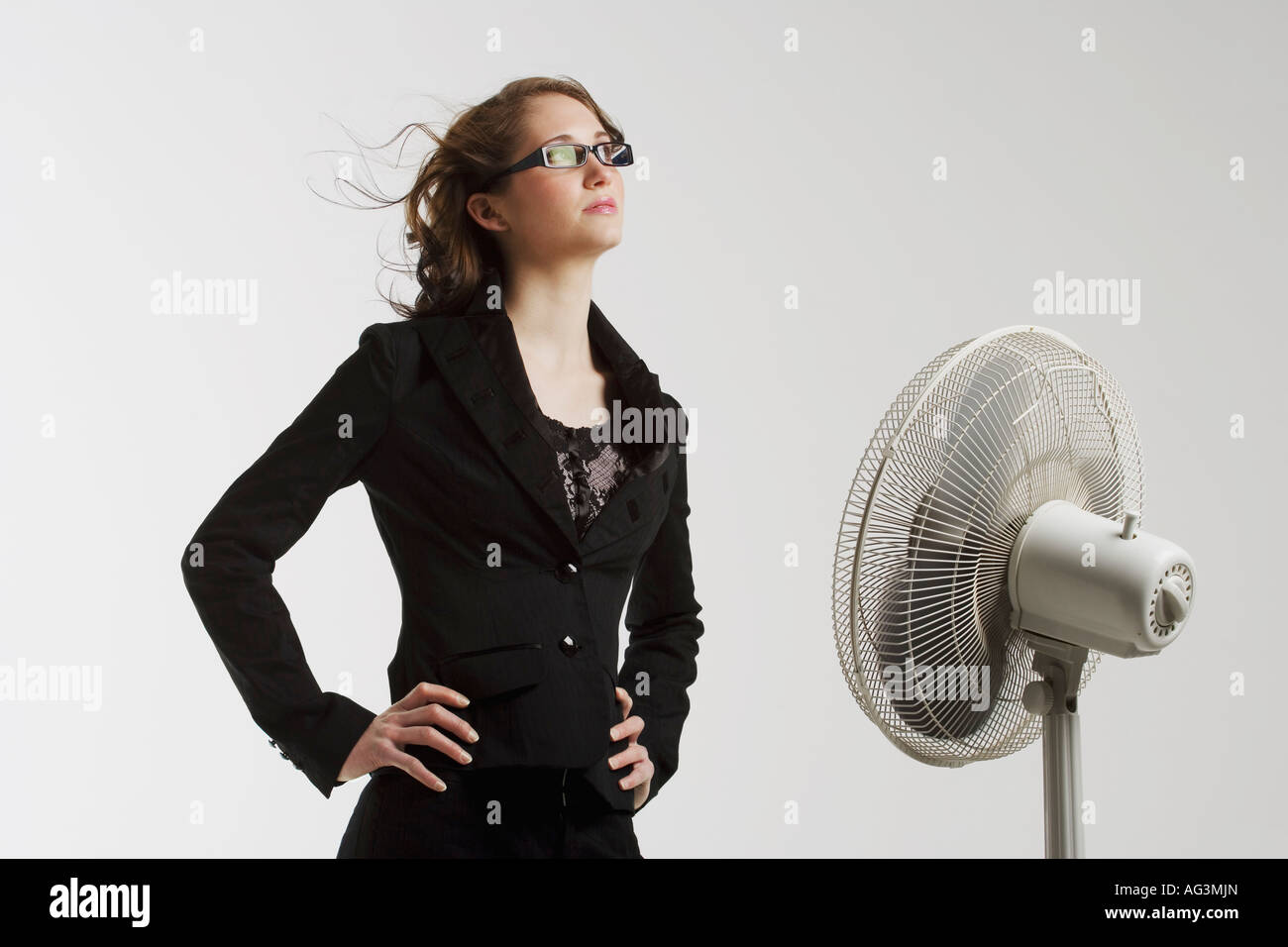 Woman standing with fan hi-res stock photography and images - Alamy