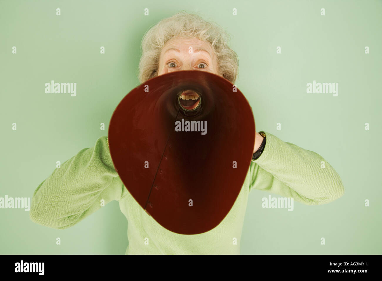 Woman shouting into a bullhorn Stock Photo - Alamy