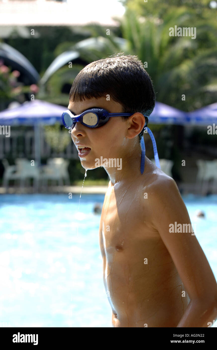 swimming pool boy with goggles Stock Photo - Alamy