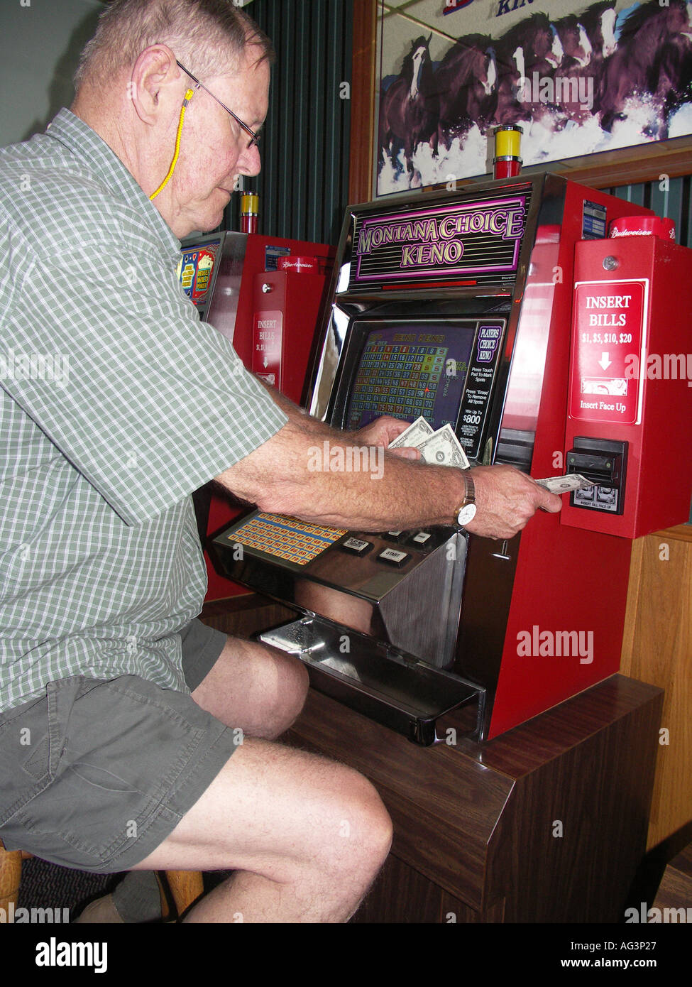 Sitting at gambling machine hi-res stock photography and images - Alamy