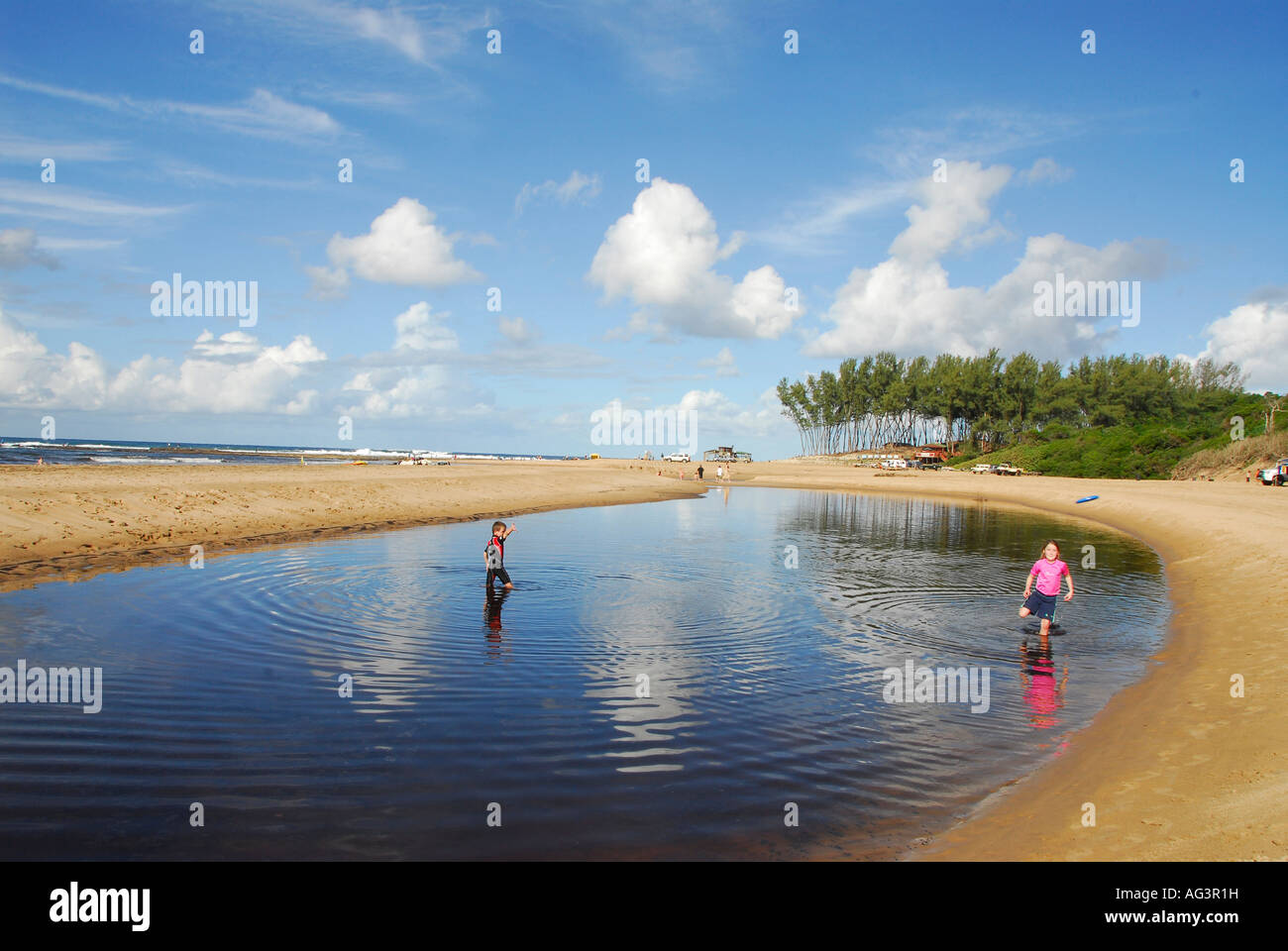 Children playing in tidal pool, Sodwana Bay, South Africa Stock Photo ...