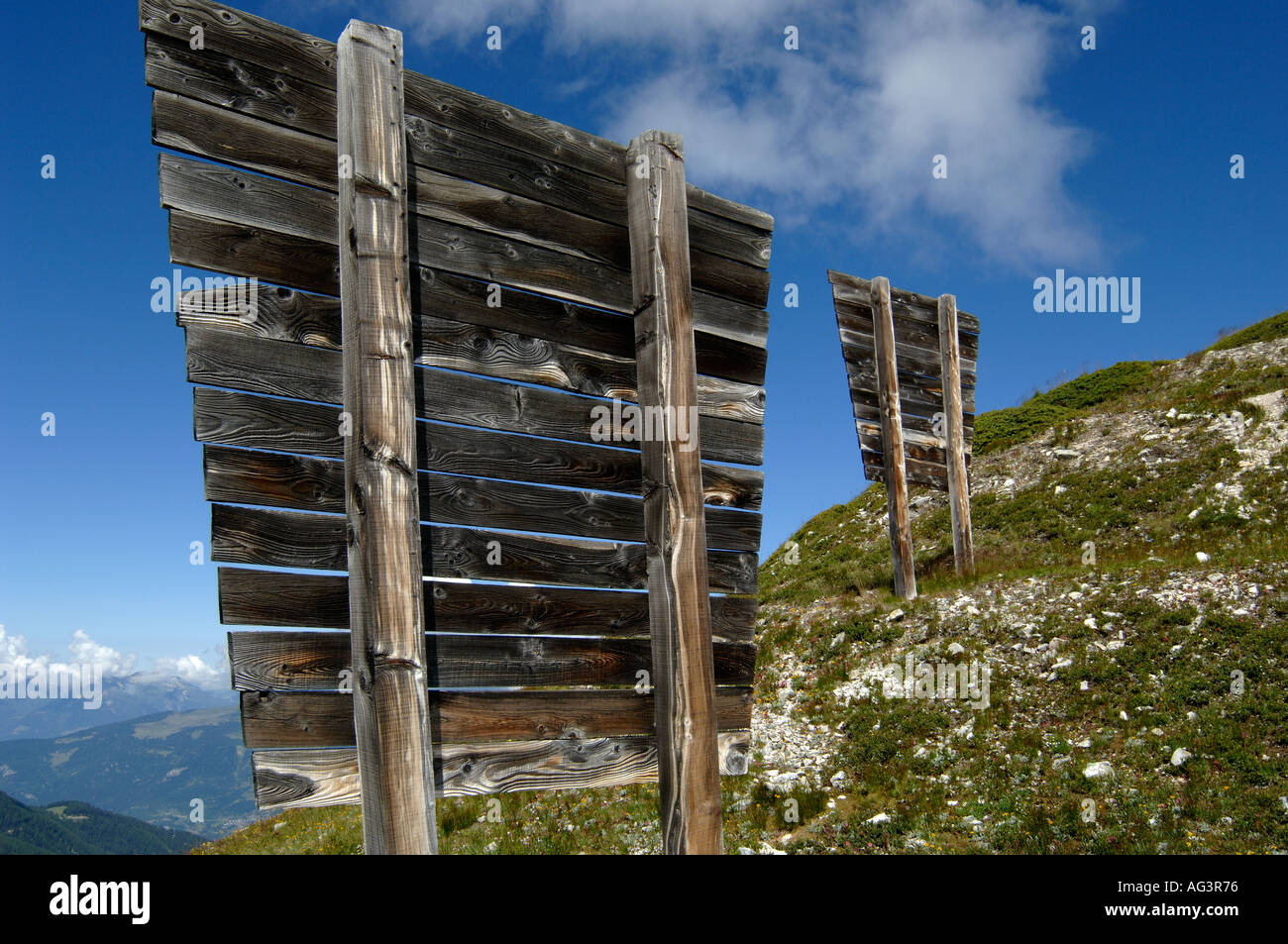 Wooden avalanche protection barriers on mountain slope in the french ...