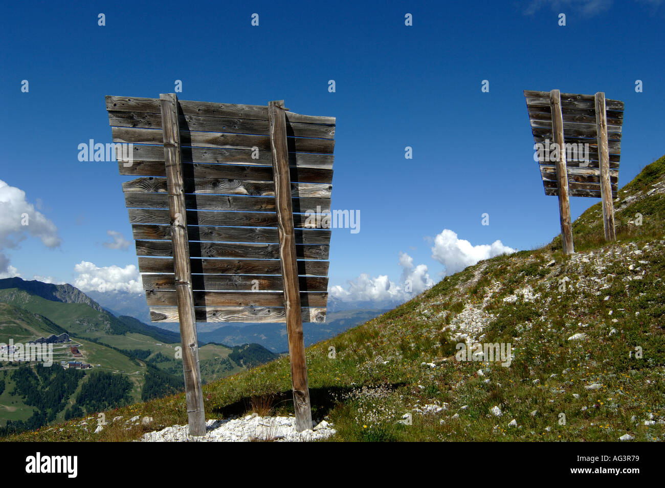 Wooden avalanche protection barriers on mountain slope in the french ...