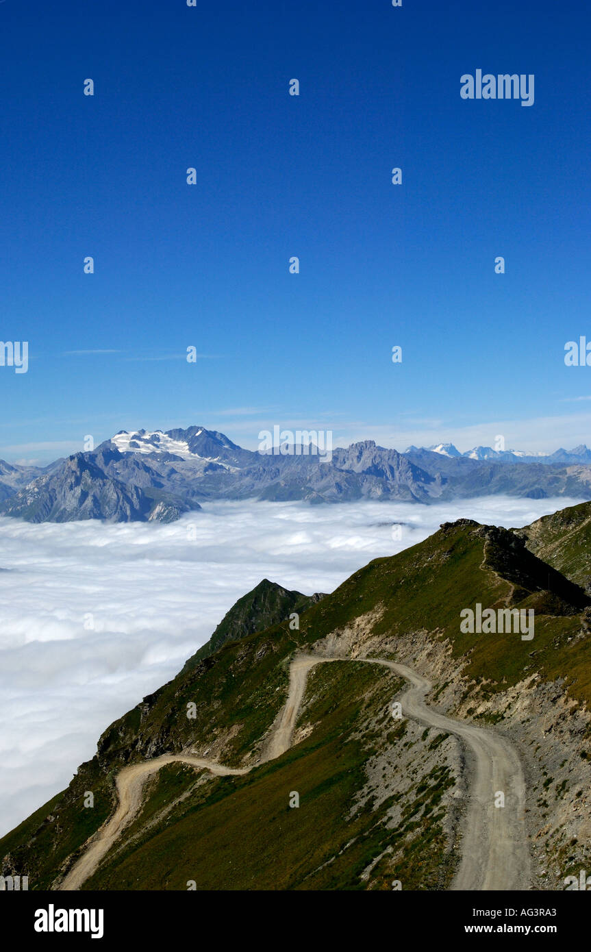 Cloud inversion in the french alps above La Plagne in summer with blue ...