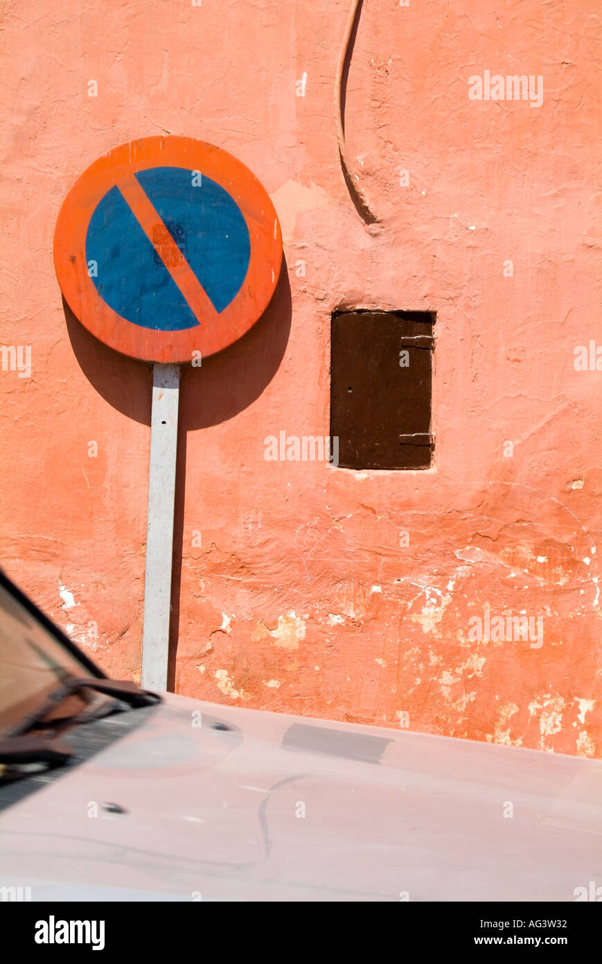 No entry sign in front of traditional pink coloured, colored, wall in ...
