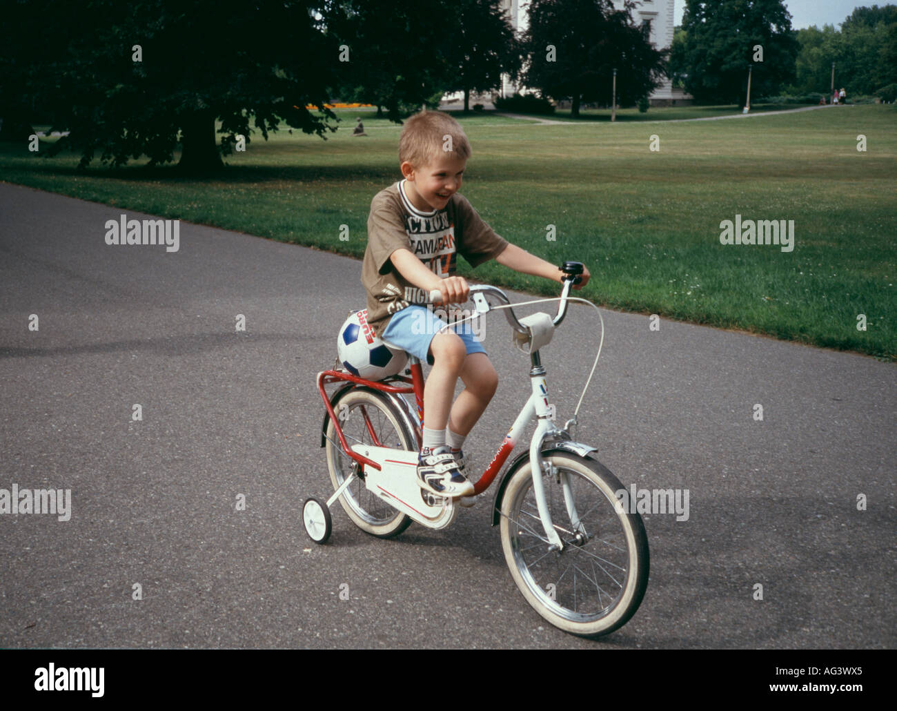 Learning to ride a bicycle Stock Photo - Alamy