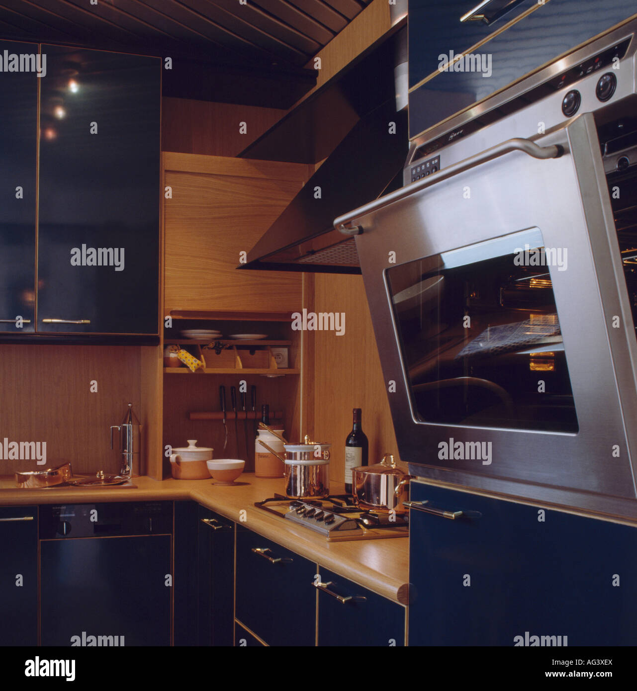 Open oven door in small galley kitchen Stock Photo - Alamy