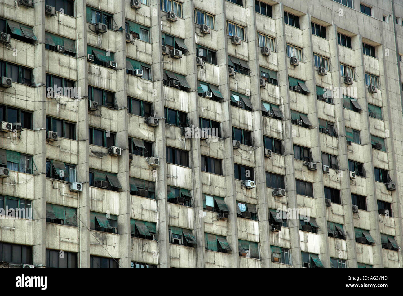 Multistorey office block with airconditioning units in windows, Cairo ...