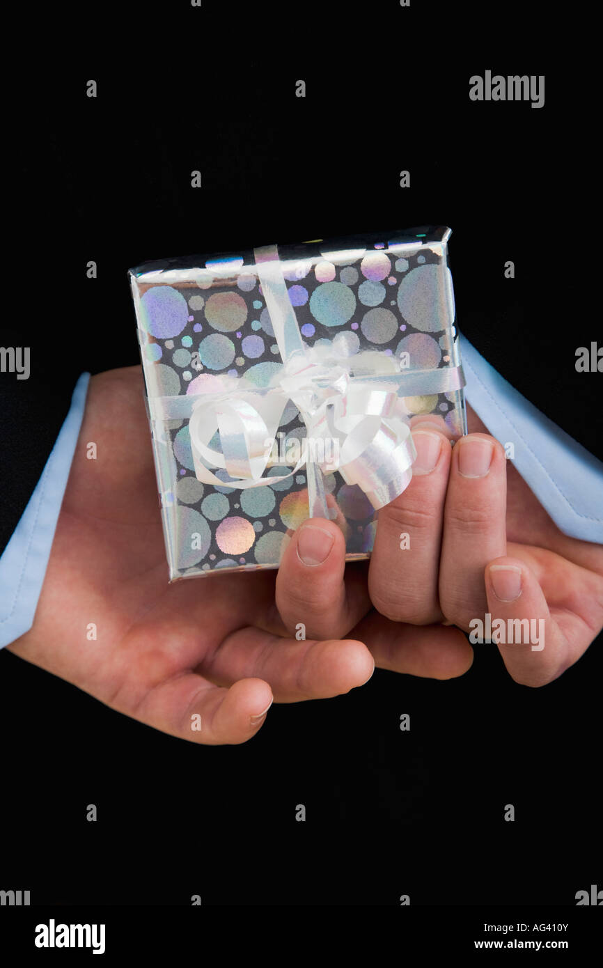 Man holding gift Stock Photo - Alamy