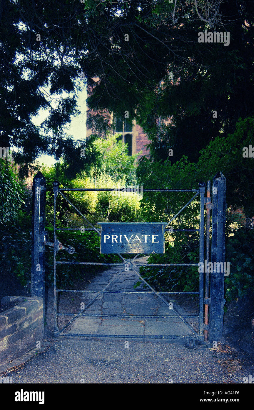 Private sign on gate with garden and building in background Stock Photo ...