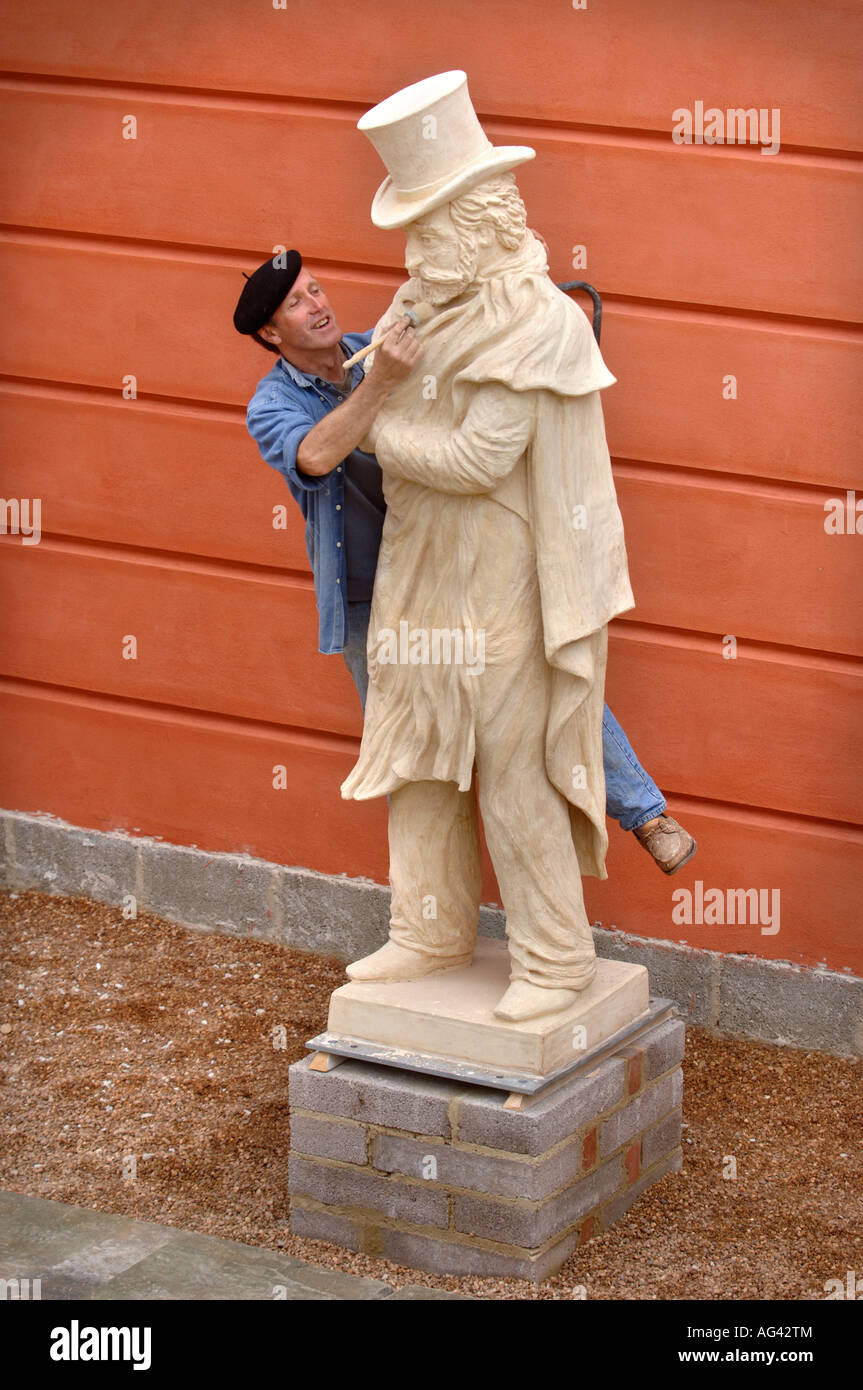 AN ARTIST WORKING ON A STATUE OF VERDI AT THE LONGBOROUGH FESTIVAL ...