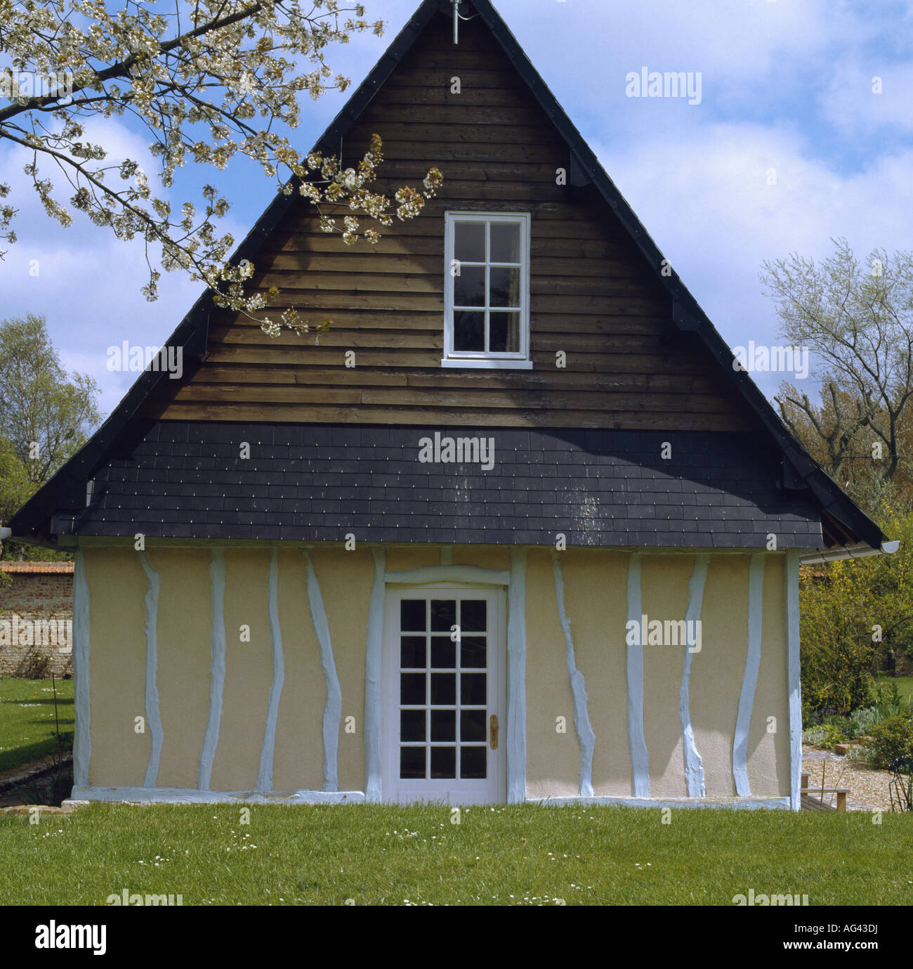 Traditional French house with gable roof and cream and white timbered ...