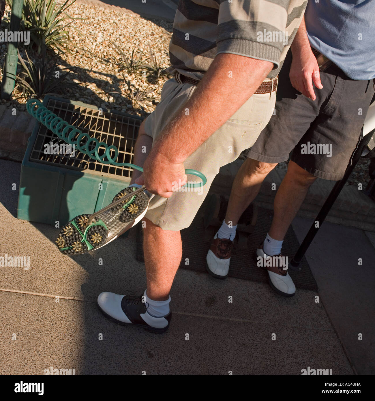 golf brushing off dirt and earth Stock Photo - Alamy