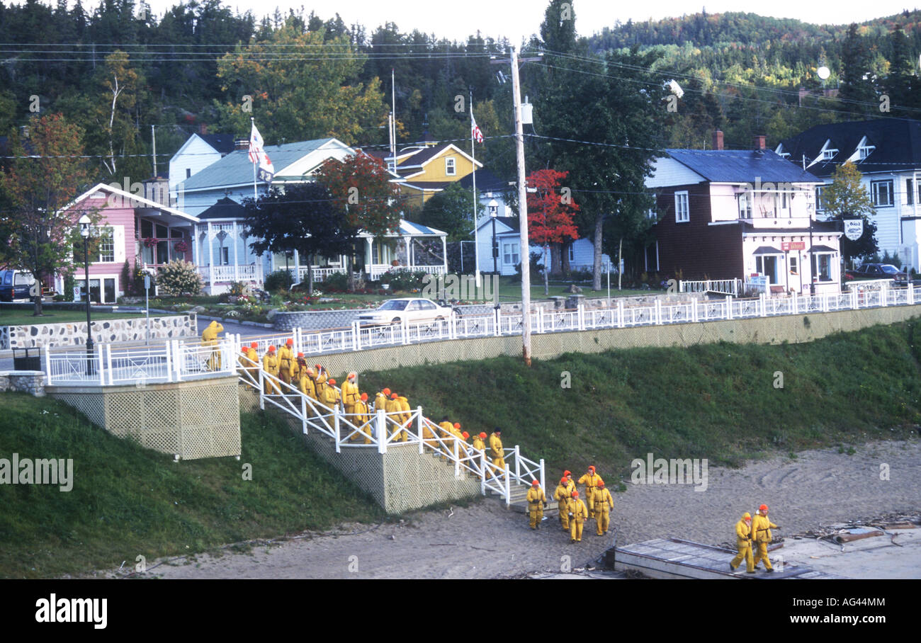 WHALEWATCHERS IN YELLOW OILSKINS AT TADOUSSAC, QUEBEC ON ST LAWRENCE ...