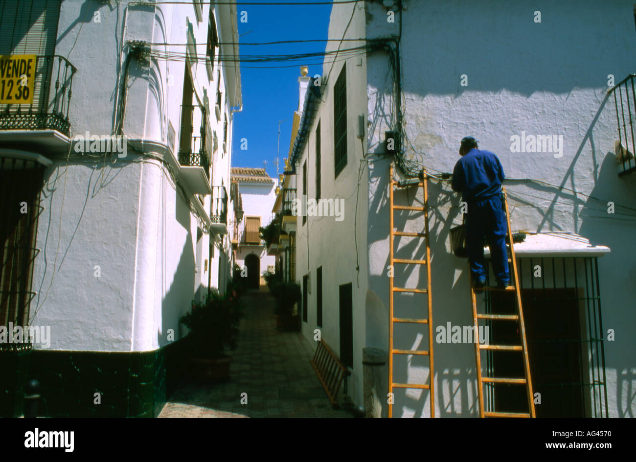 spanish engineer working in whitewashed street in Marbella Spain Stock ...