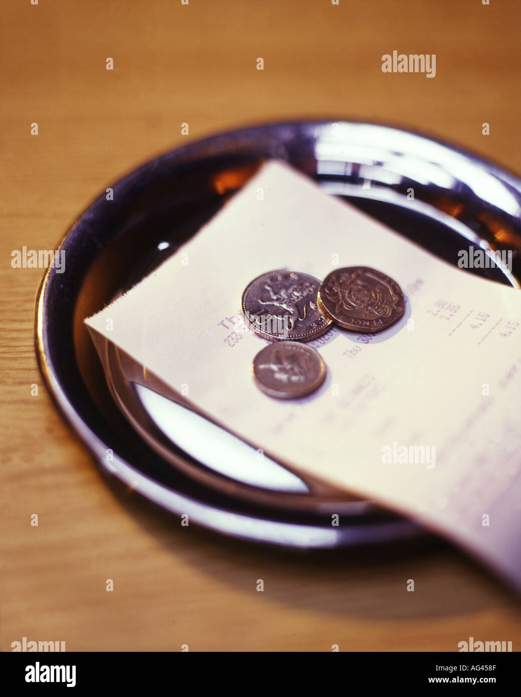 tip tray with a till receipt Stock Photo - Alamy