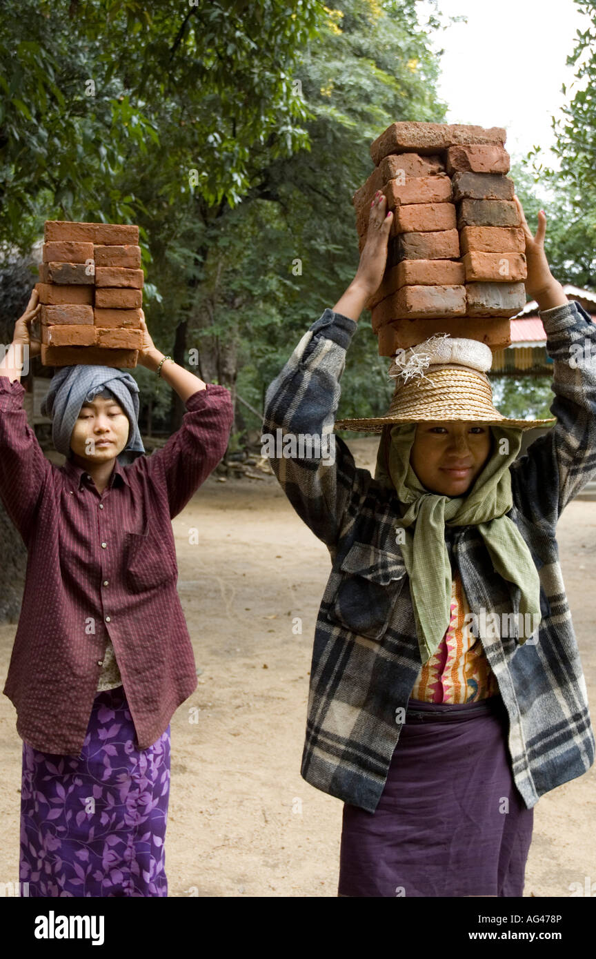 Women carrying bricks hi-res stock photography and images - Alamy