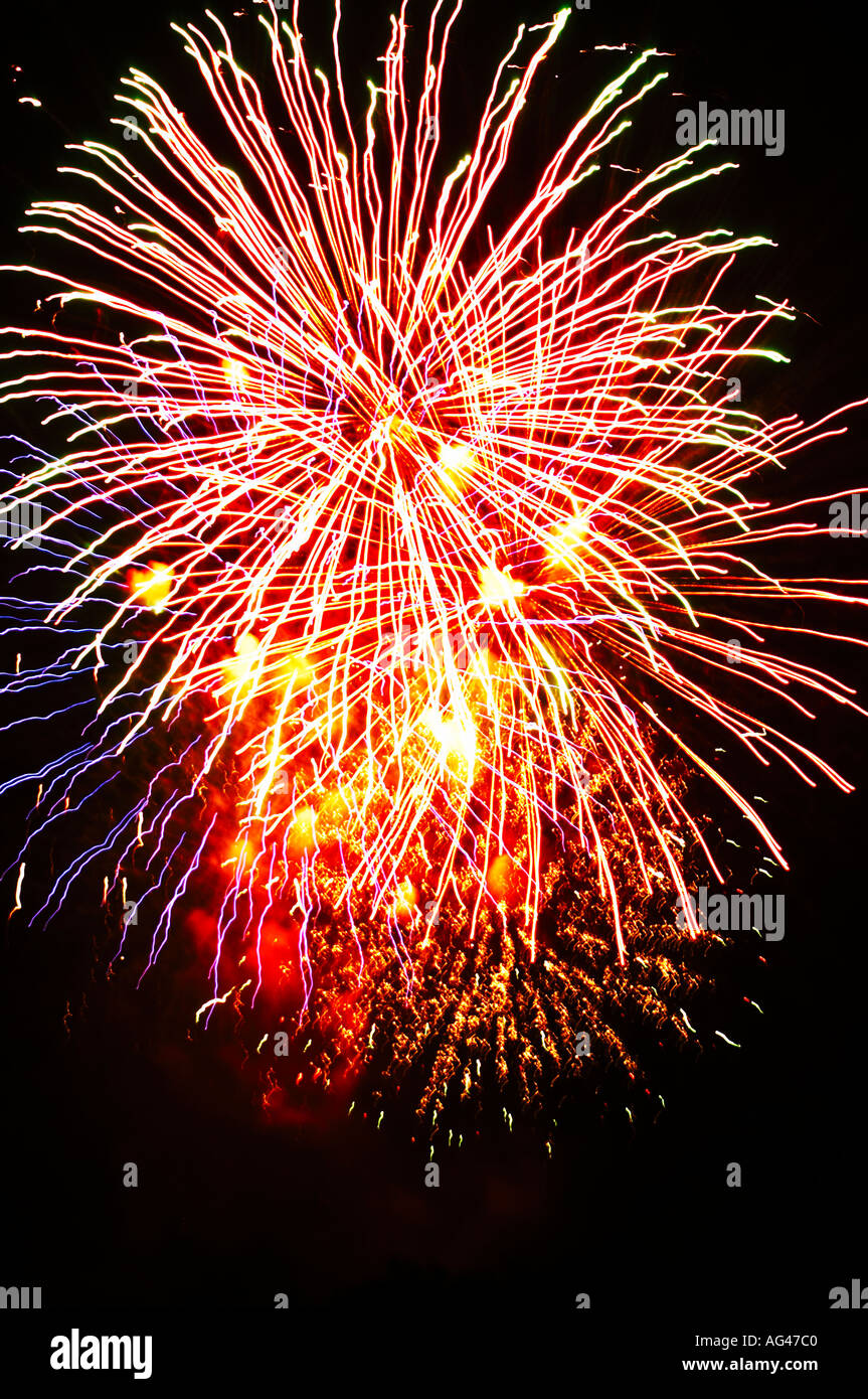 Let off fireworks in the night sky Stock Photo - Alamy