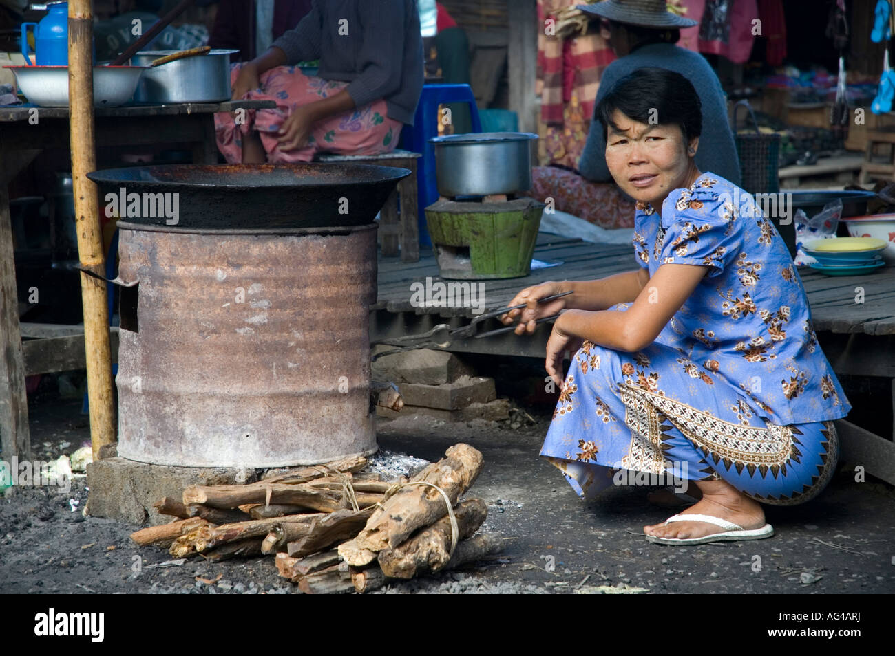Tending the fire hi-res stock photography and images - Alamy