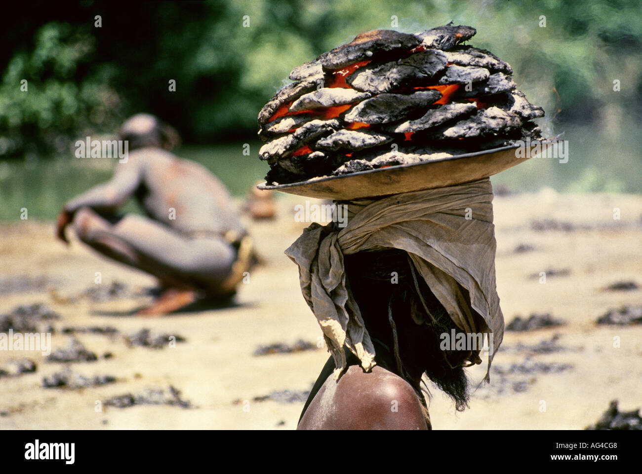 A sadhu carrying burning cowdung on his head as hi-res stock ...